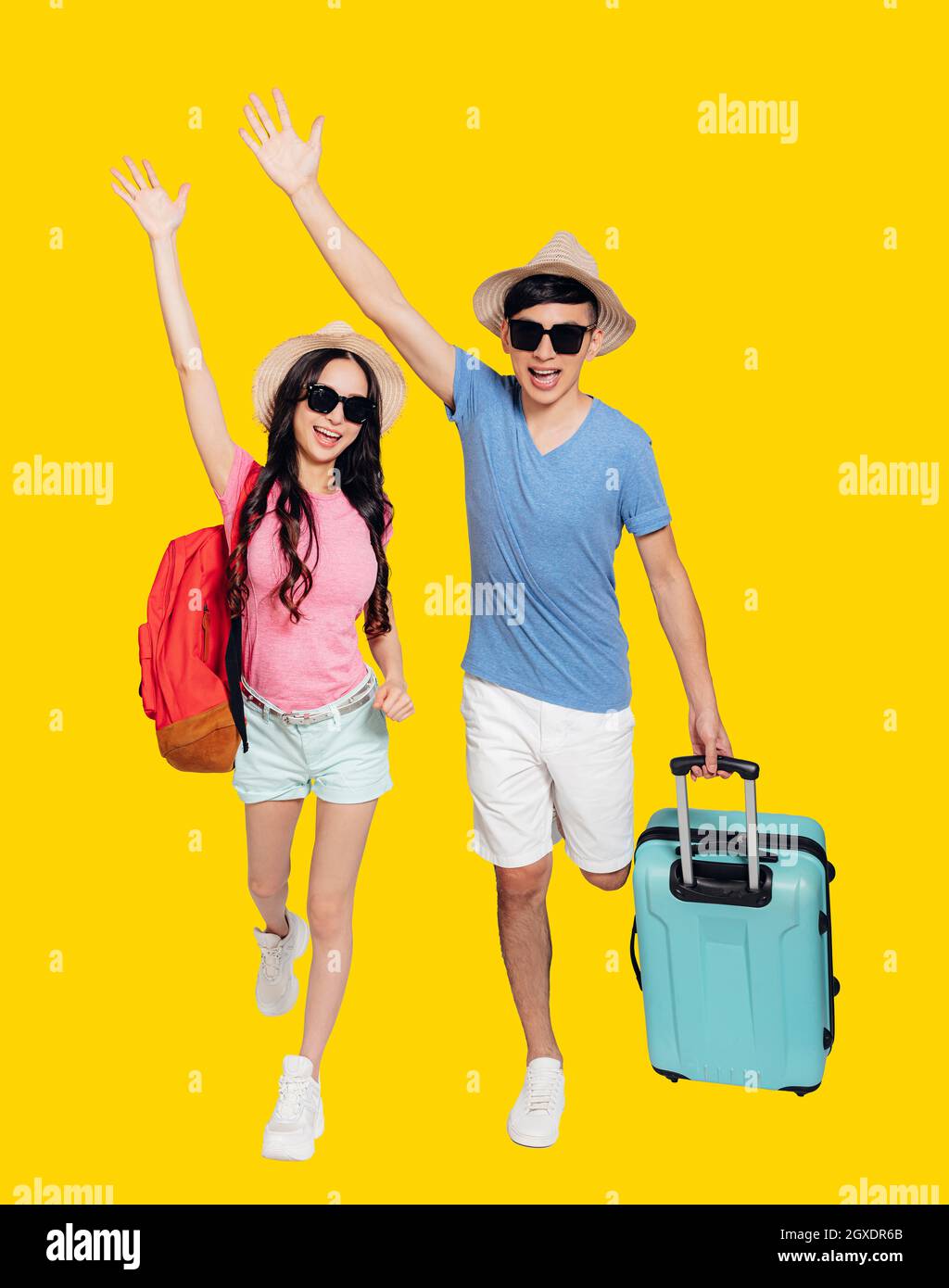 Happy excited young couple tourists running forward and ready for ...