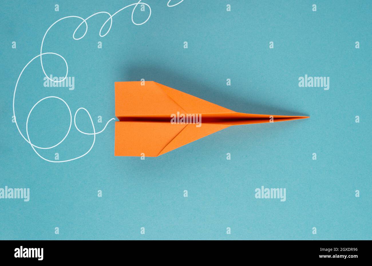 Paper airplanes in different colors on a white background, standing out ...