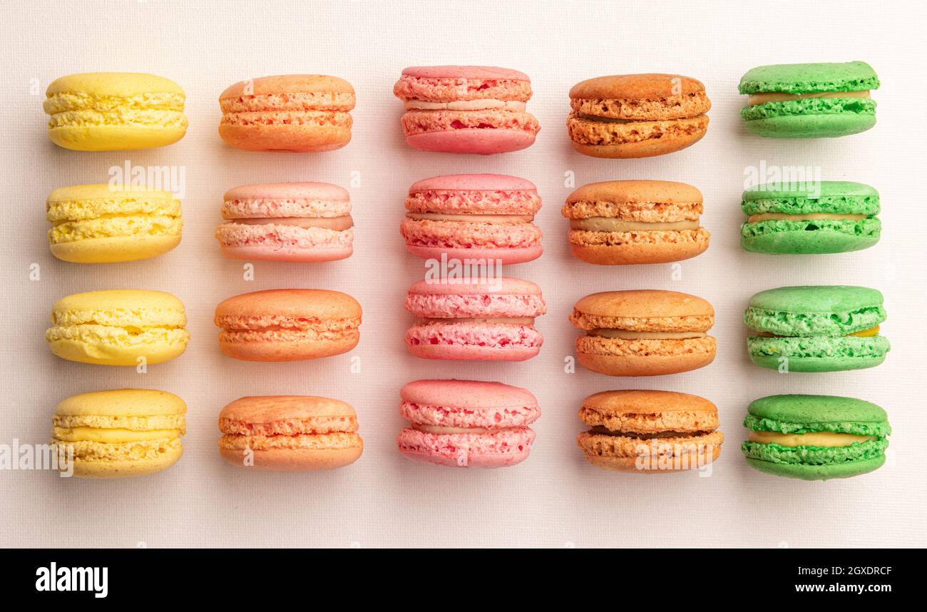 Sweet and colorful French macaroons in row, top view, flat lay Stock ...