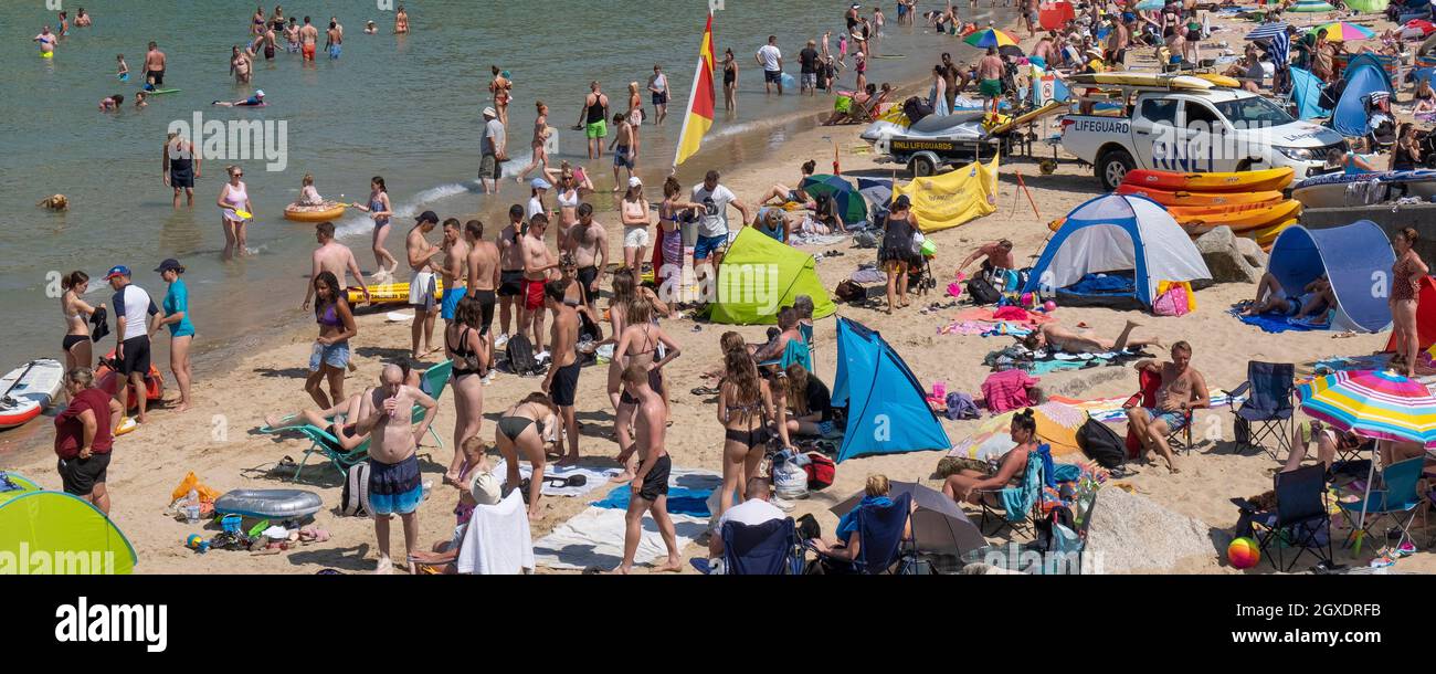 A panoramic image of an extremely busy Towan Beach crowded with ...