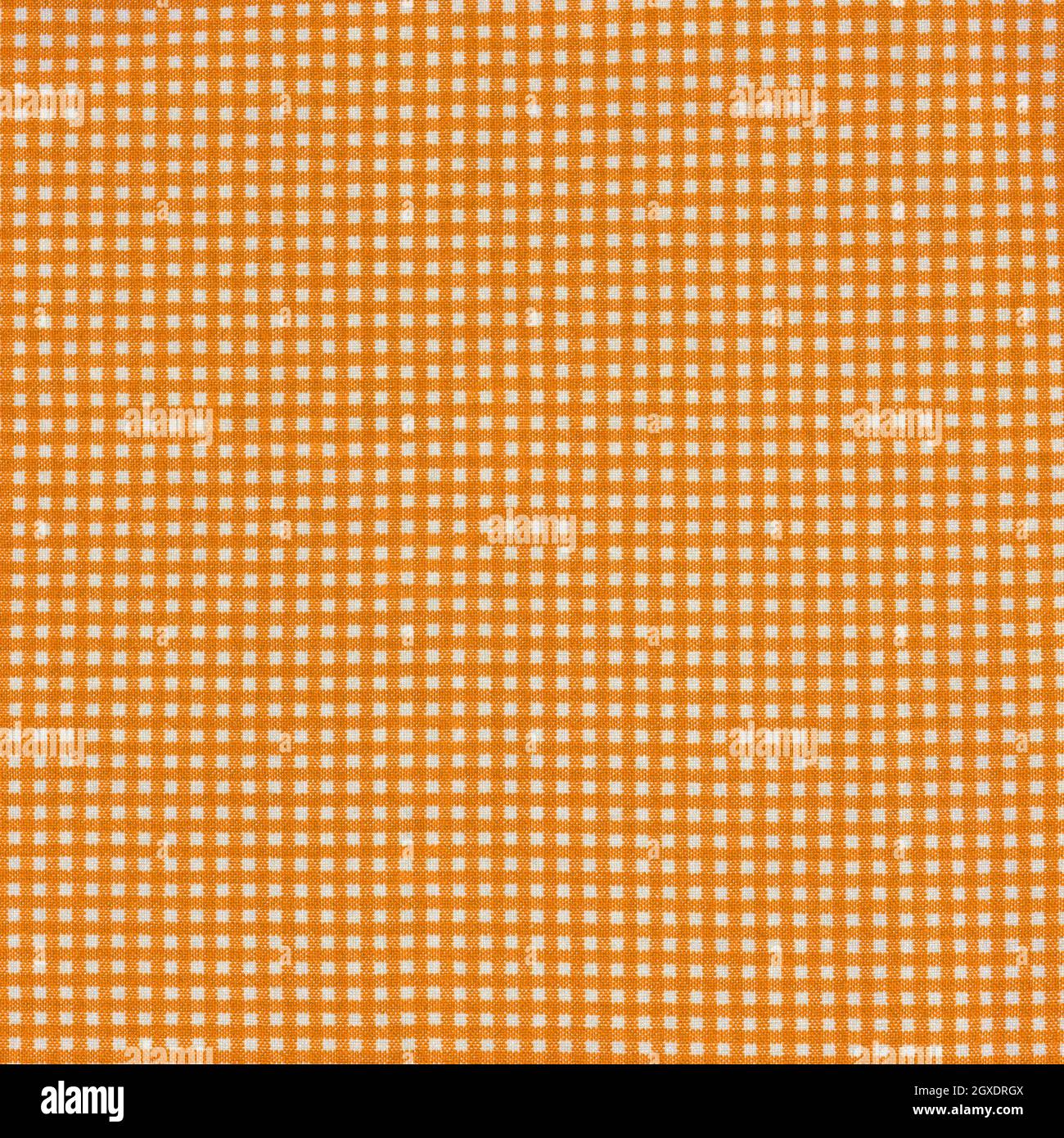 Orange checkered tablecloth background texture. Gingham fabric ...