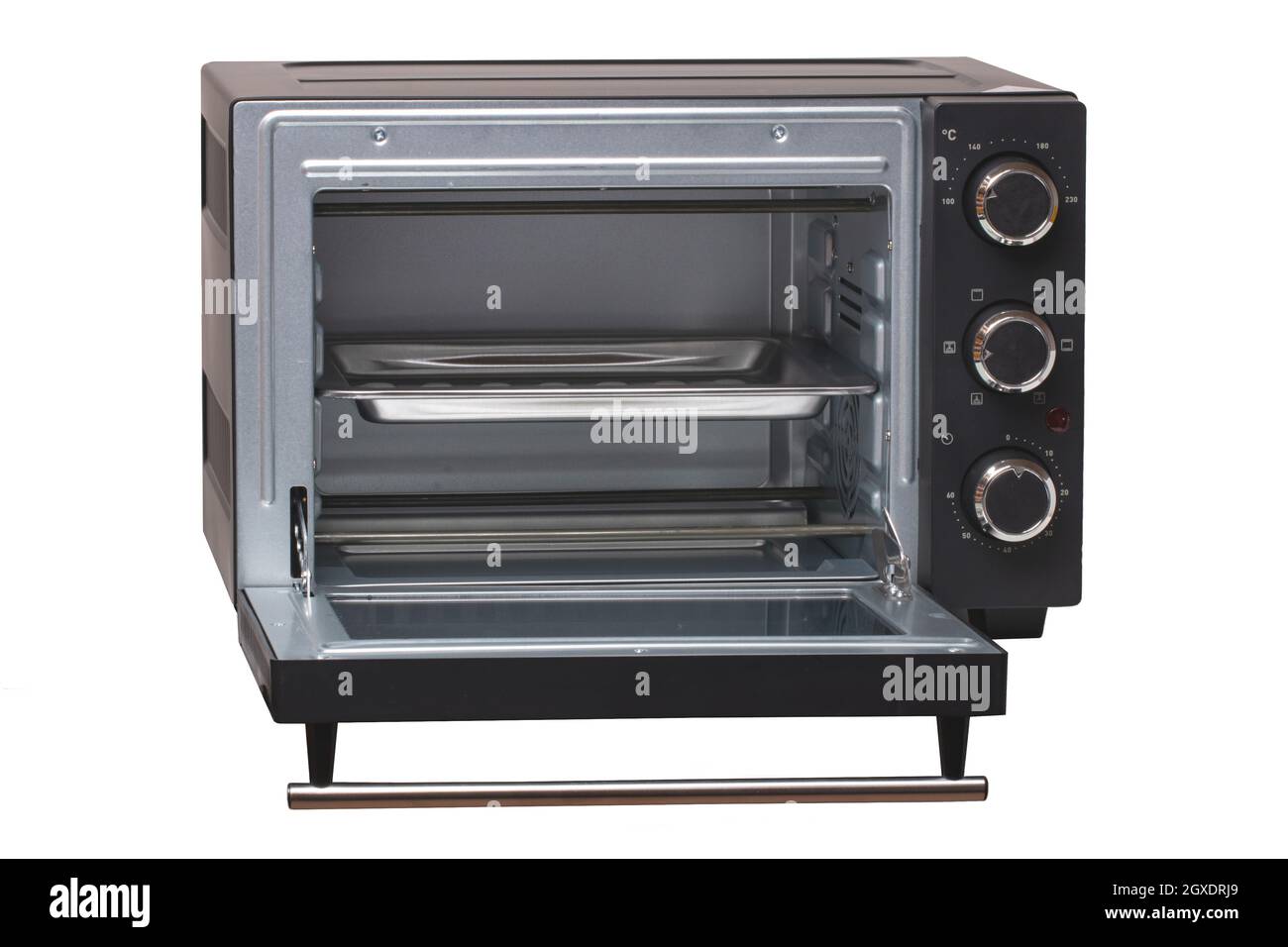 Household kitchen appliances. Close-up of a small opened electric oven ...