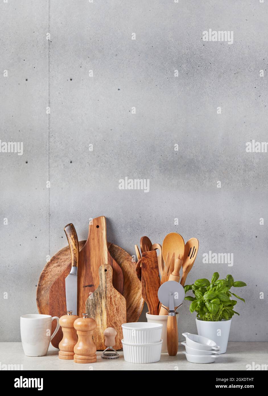 Kitchen utensils on concrete countertop Stock Photo - Alamy