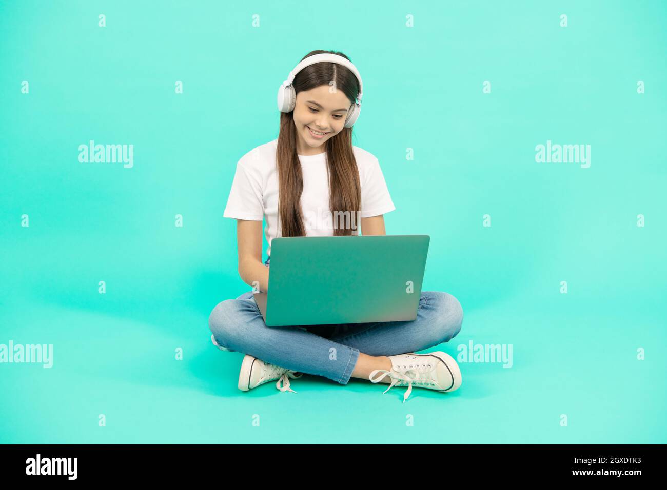 happy teen girl use computer for video call or listen webinar in ...