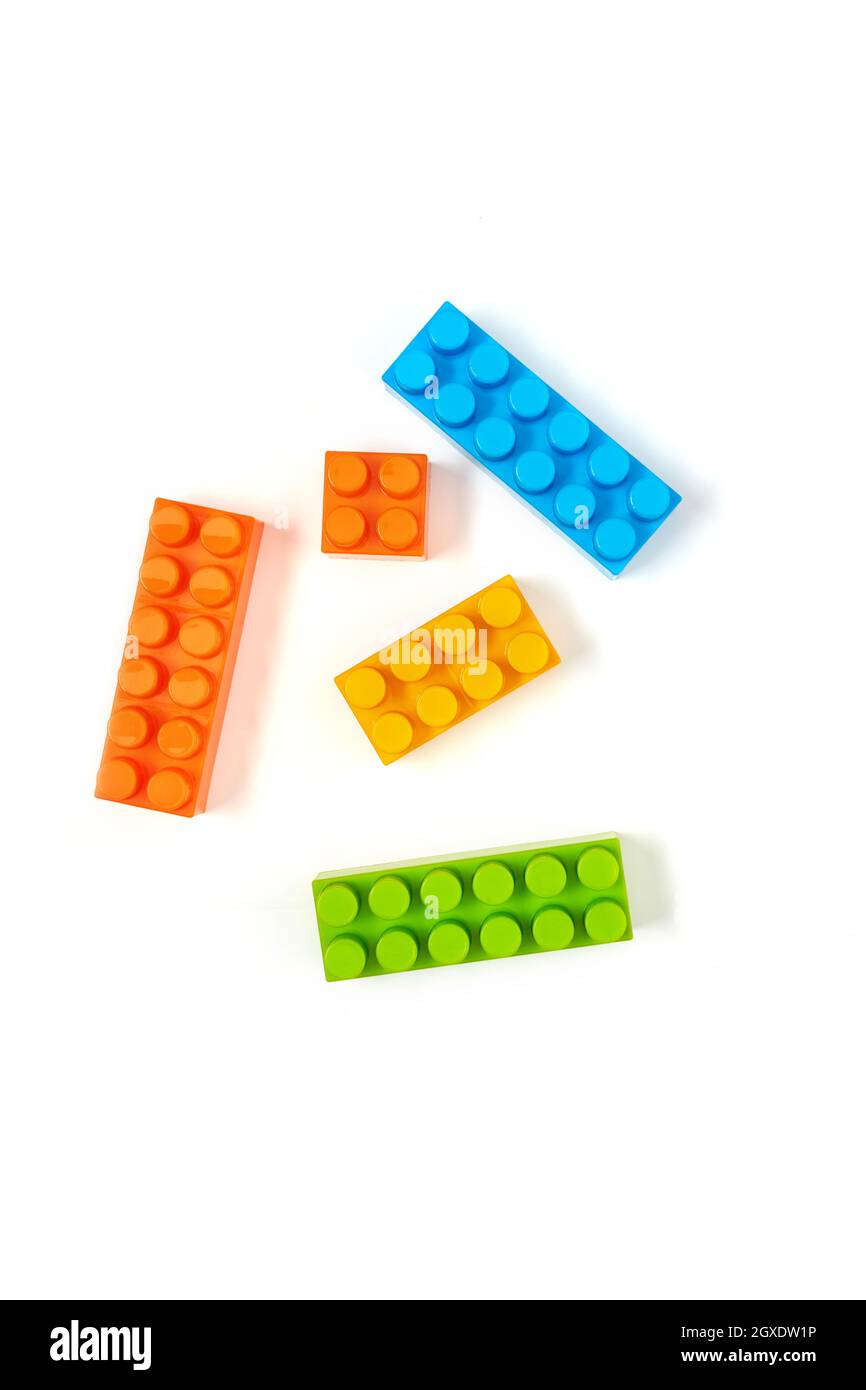 Plastic toy blocks on white background Stock Photo - Alamy
