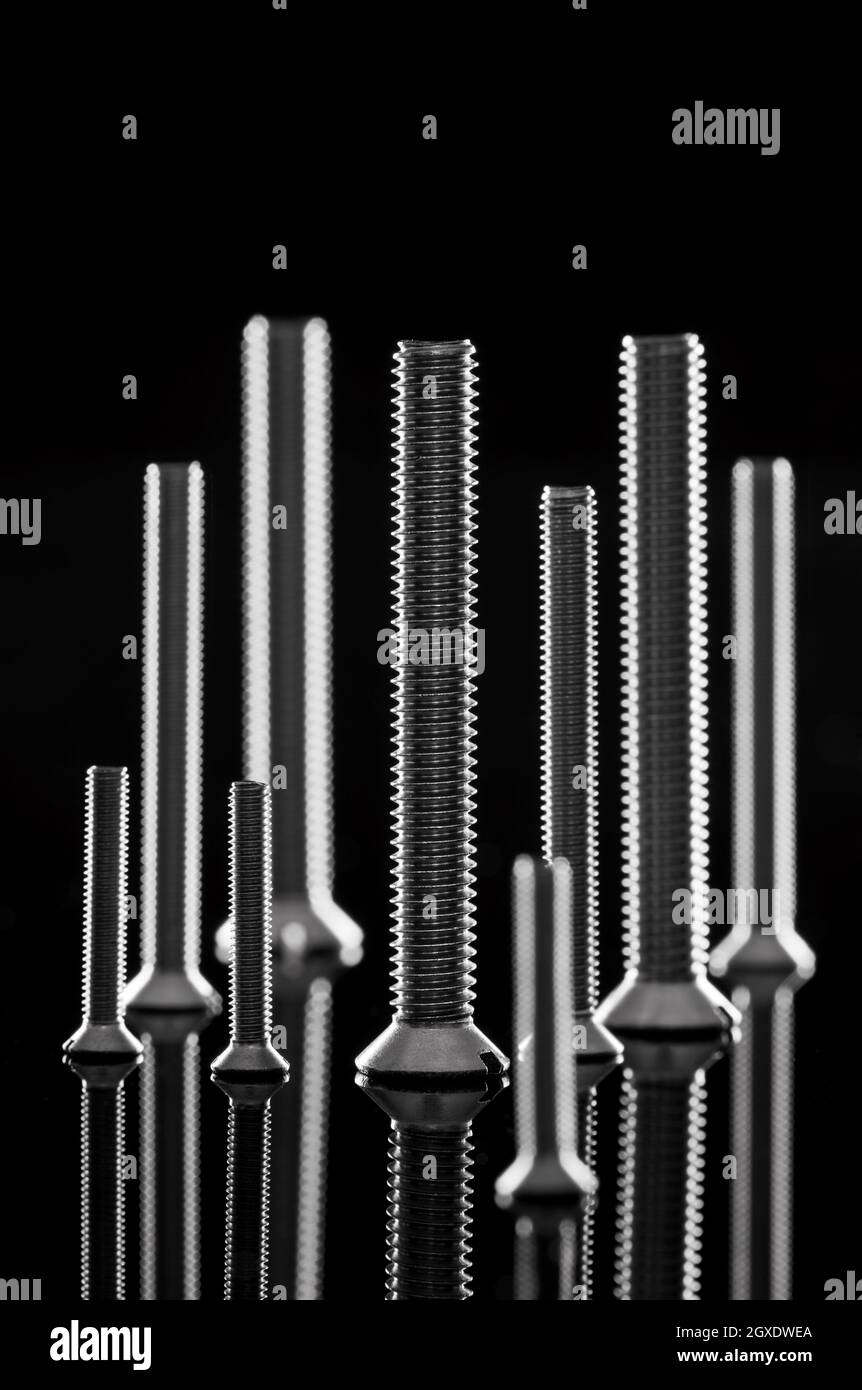 Chrome screws on black background looking like a cityscape Stock Photo ...