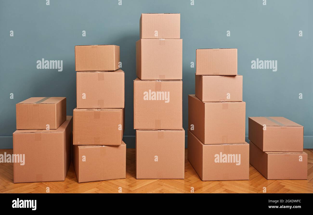Cardboard boxes in room Stock Photo - Alamy