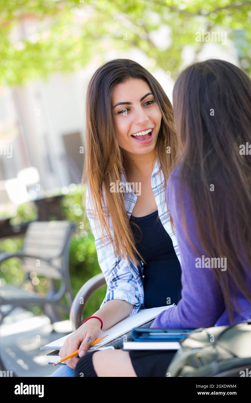 Attractive Expressive Young Mixed Race Female Student Sitting and ...