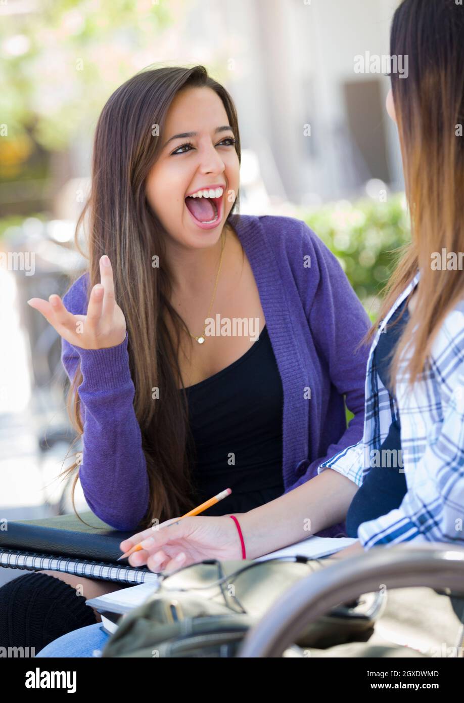 Attractive Expressive Young Mixed Race Female Student Sitting and ...