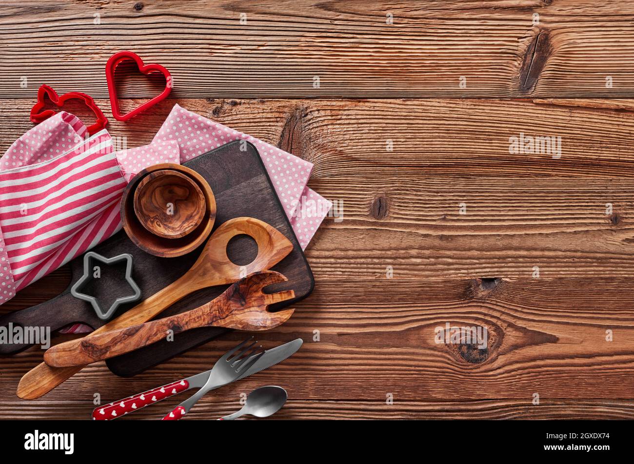 Kitchen utensils on wooden table Stock Photo - Alamy