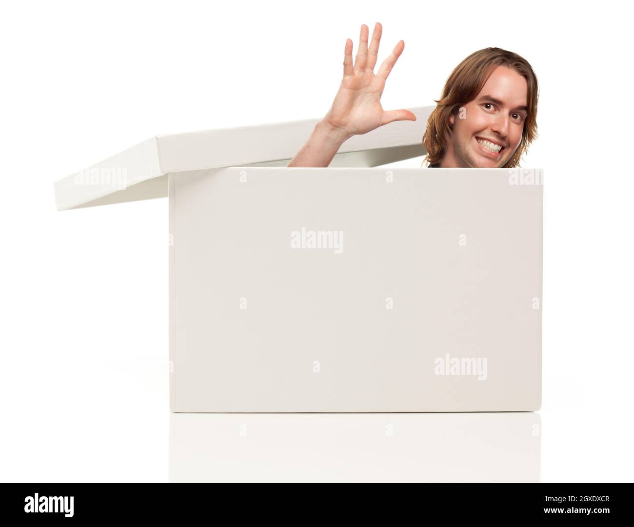 Young man popping head out hi-res stock photography and images - Alamy