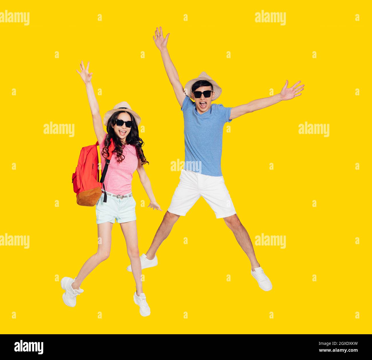 Happy excited young couple tourists jumping and ready for travel Stock ...
