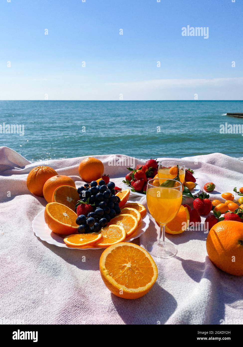 fresh fruit at the beach. Fruits in the sun. Summer time beach concept ...