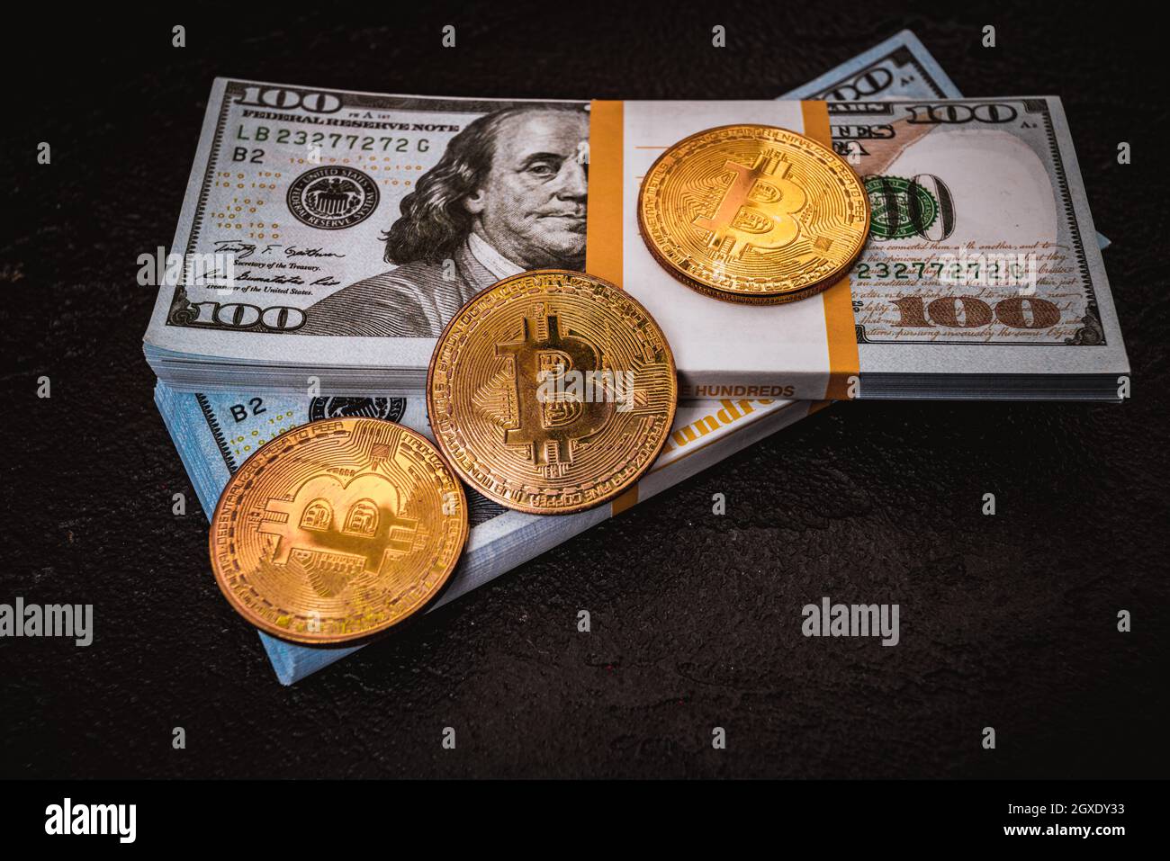 golden bitcoin metal coin on one US dollar bill Stock Photo - Alamy