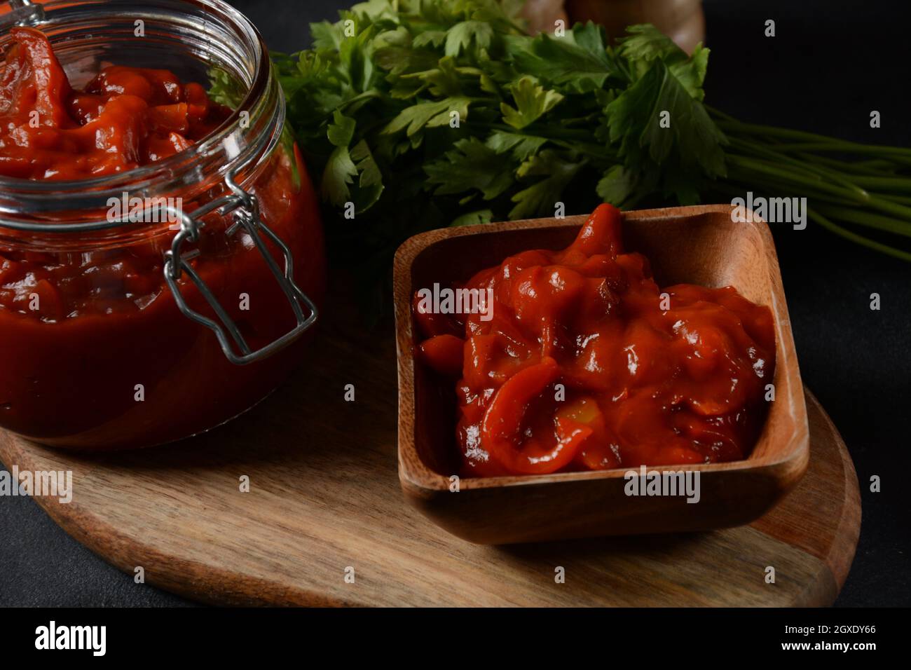 A jar of stewed salad with pepper and tomato(lecho). Traditional ...