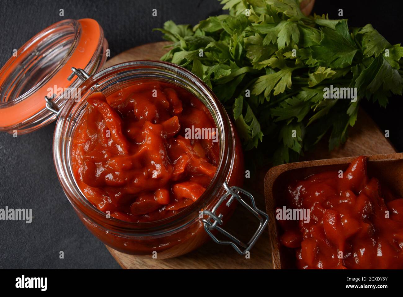 A jar of stewed salad with pepper and tomato(lecho). Traditional ...