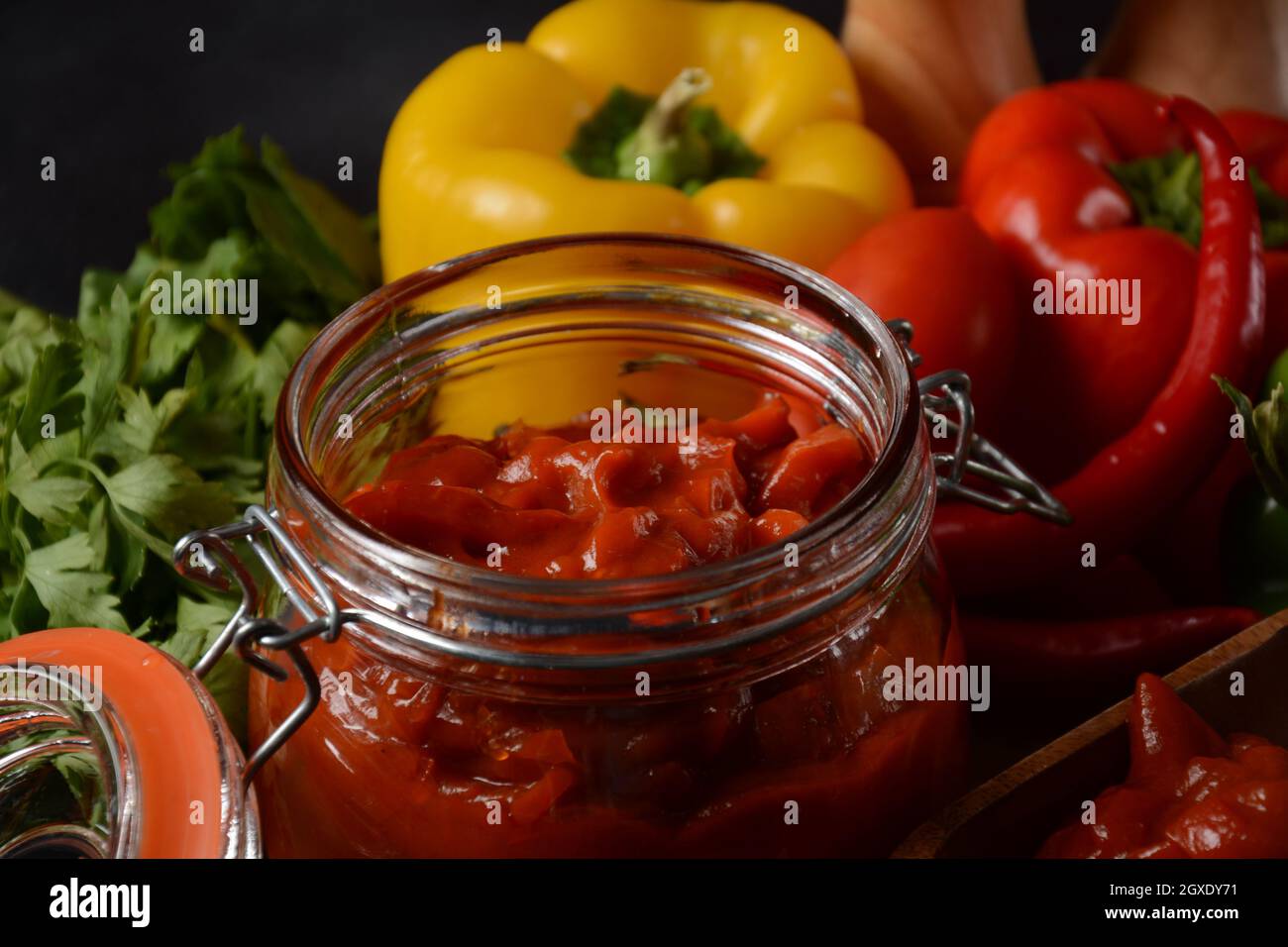 A jar of stewed salad with pepper and tomato(lecho). Traditional ...