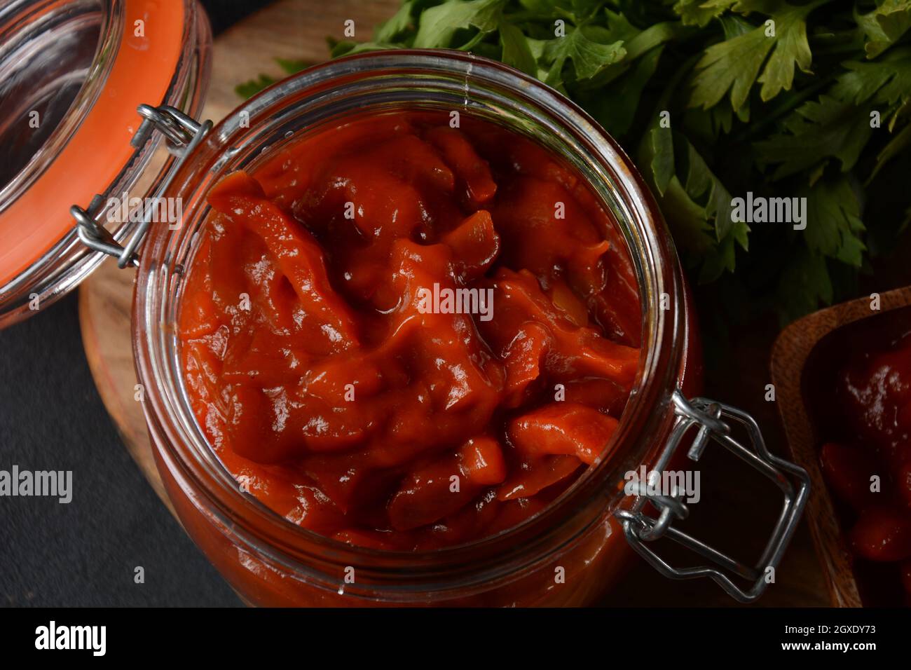 A jar of stewed salad with pepper and tomato(lecho). Traditional ...