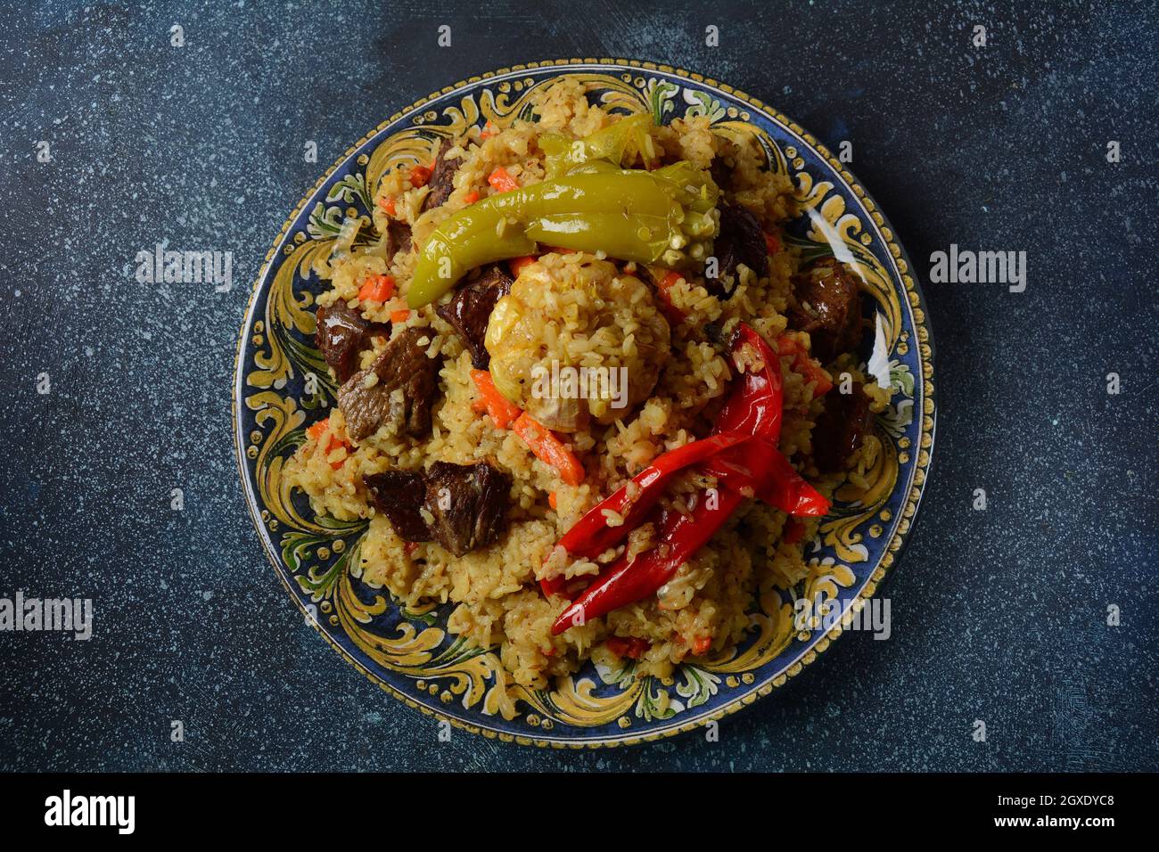 Uzbek cuisine (food) pilaf (plov).Mutton, rice, carrots, vegetable oil ...