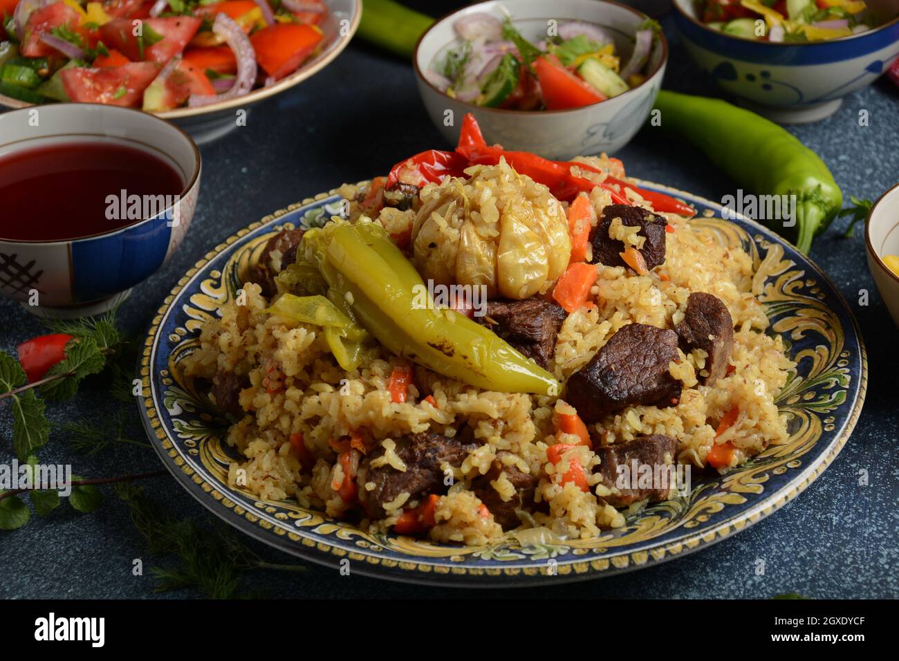 Uzbek cuisine (food) pilaf (plov), salad achichuk (achuchuk).Mutton ...