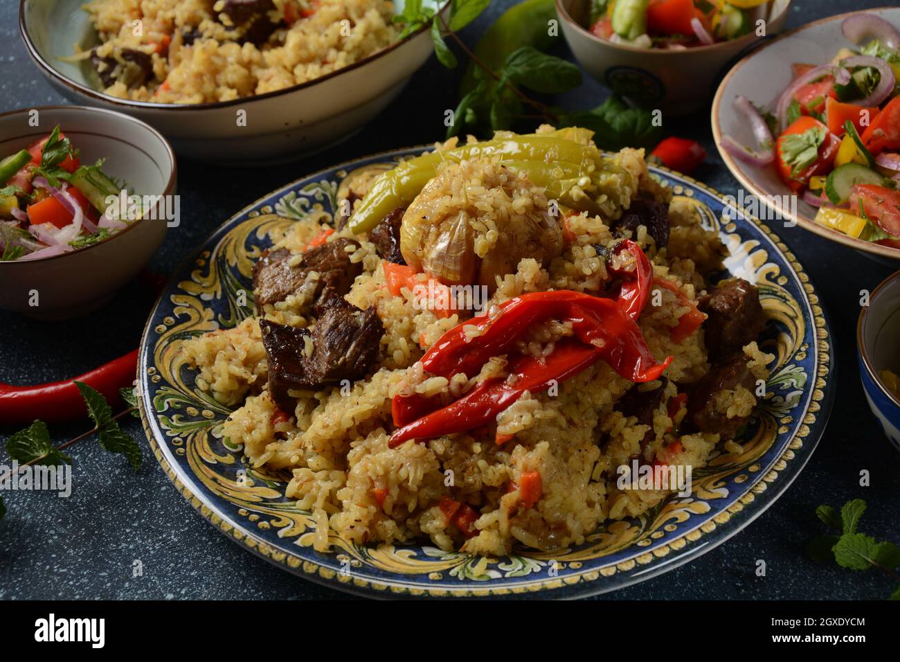 Uzbek cuisine (food) pilaf (plov), salad achichuk (achuchuk).Mutton ...