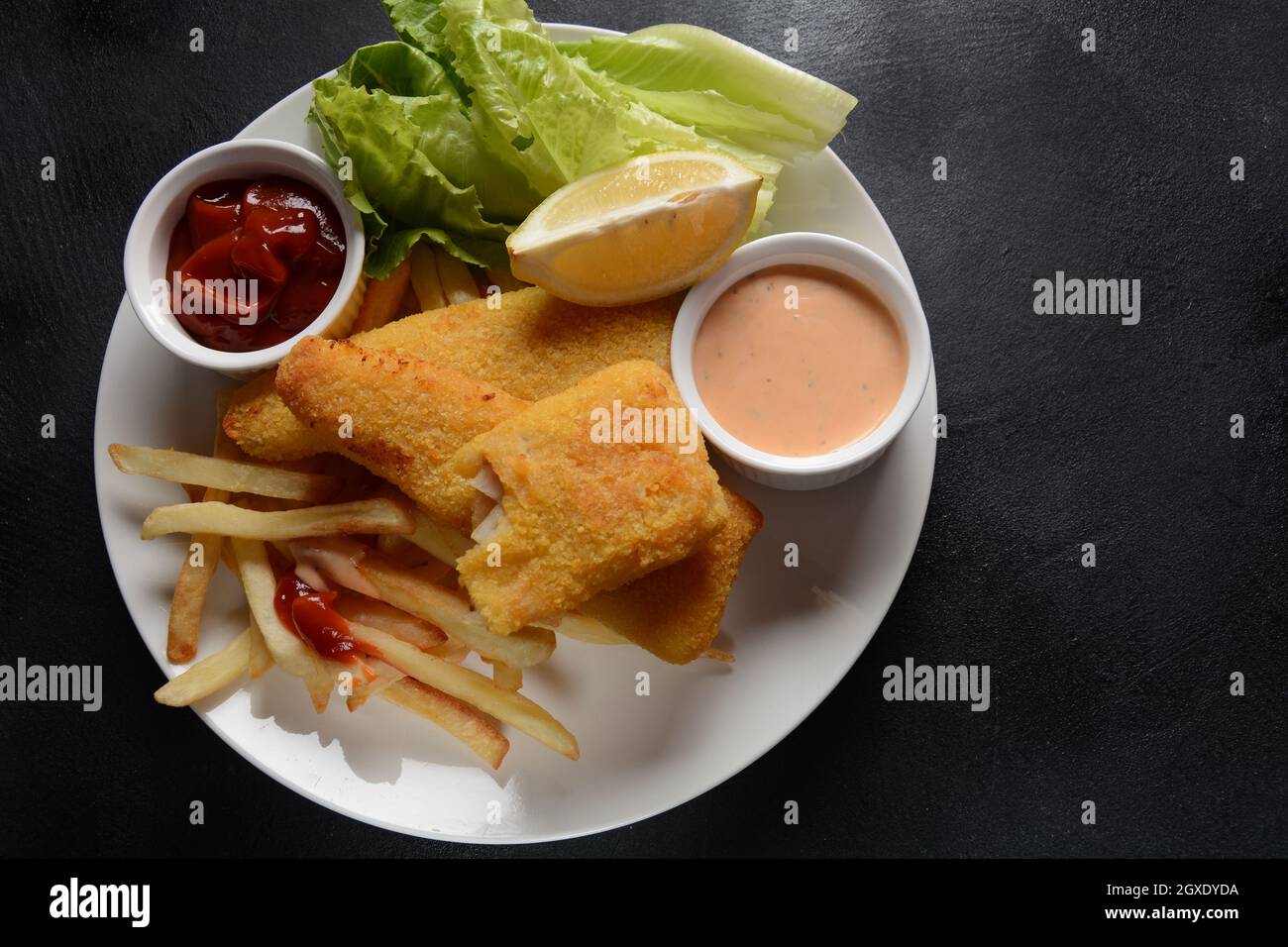 Traditional English Food - Fish and Chips. Fried fish filets and crispy ...