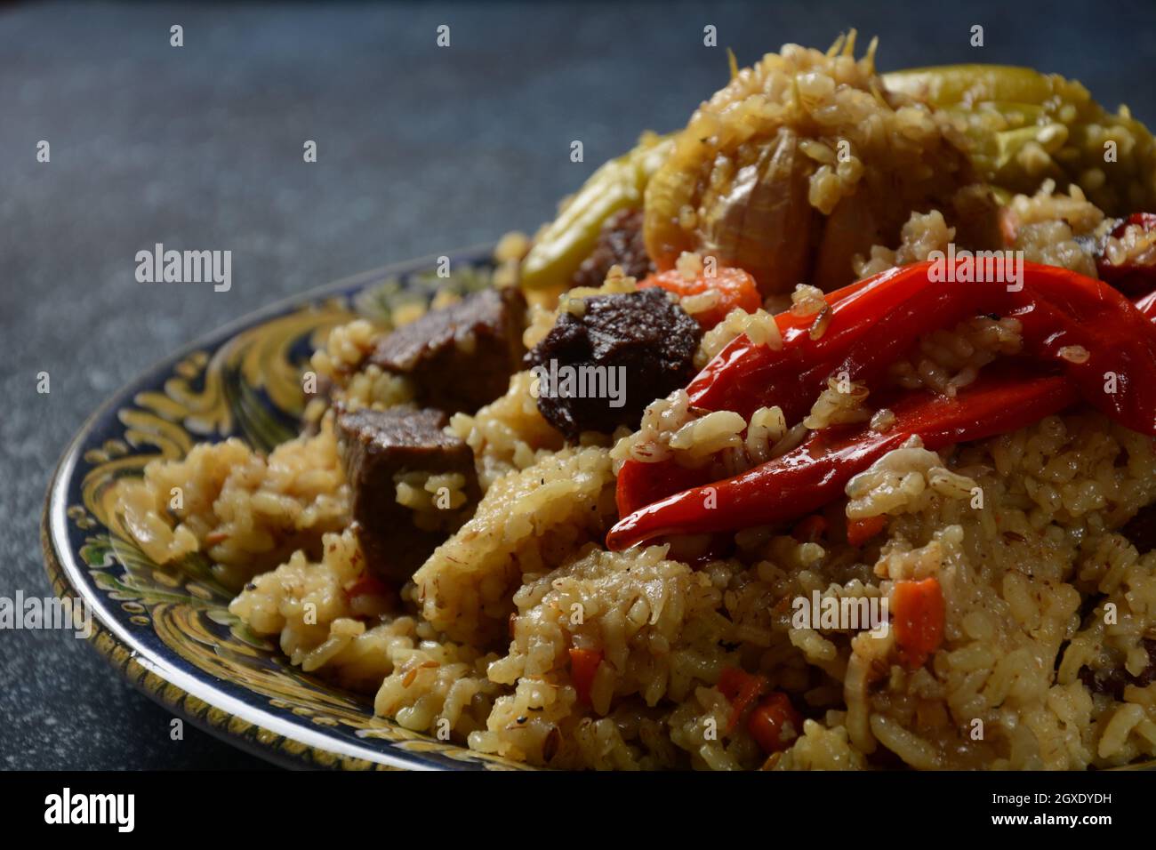Uzbek cuisine (food) pilaf (plov).Mutton, rice, carrots, vegetable oil ...