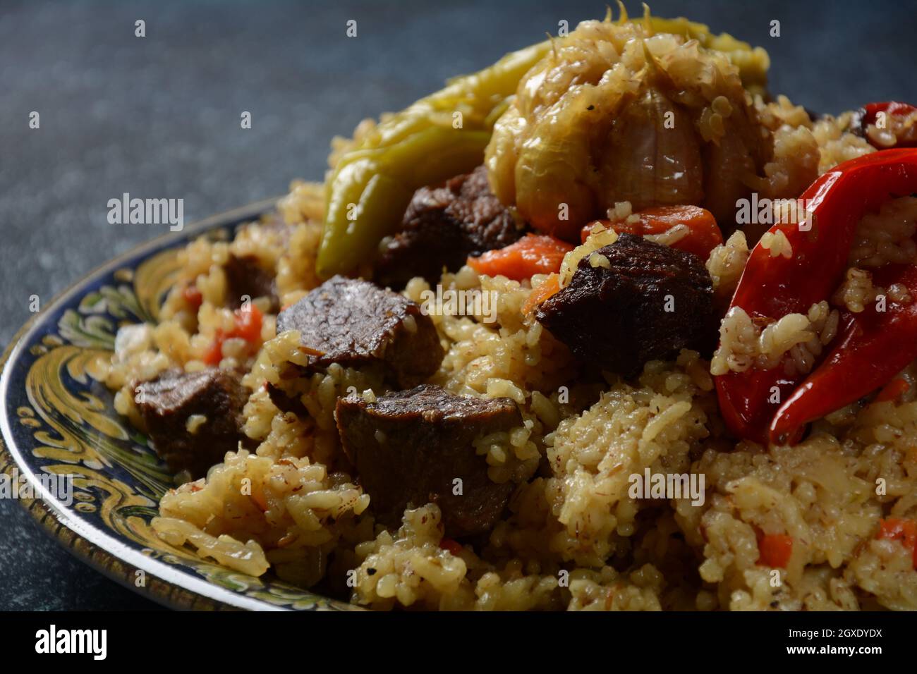 Uzbek cuisine (food) pilaf (plov).Mutton, rice, carrots, vegetable oil ...