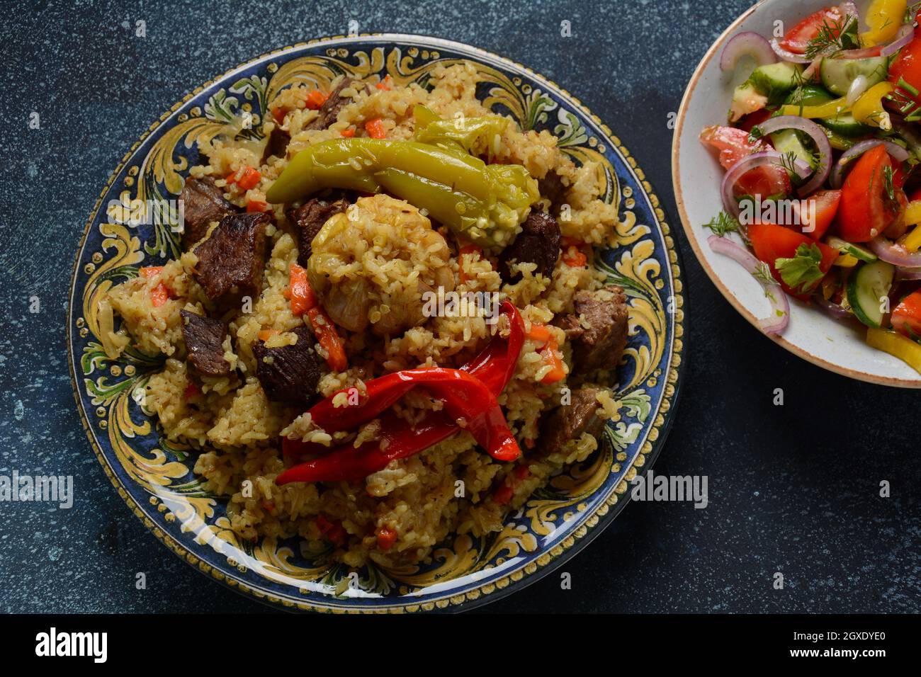 Uzbek cuisine (food) pilaf (plov), salad achichuk (achuchuk).Mutton ...