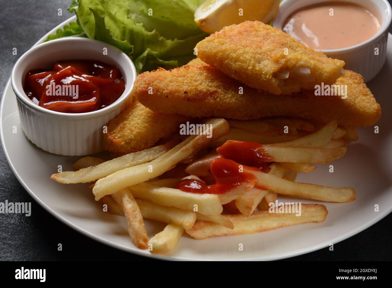 Traditional English Food - Fish and Chips. Fried fish filets and crispy ...