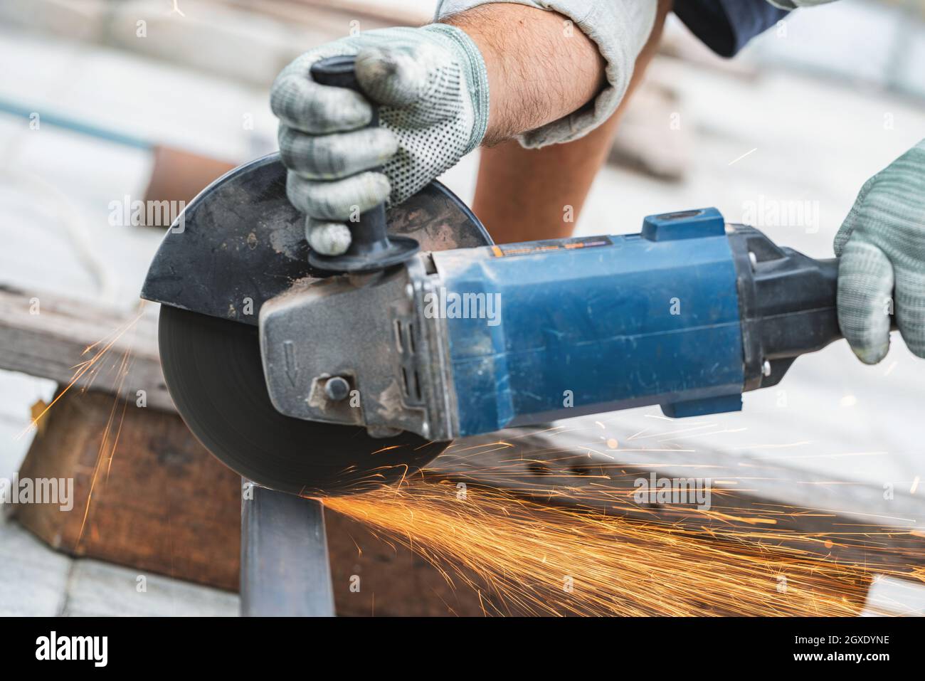 working with a circular saw cutting metal close-up Stock Photo - Alamy