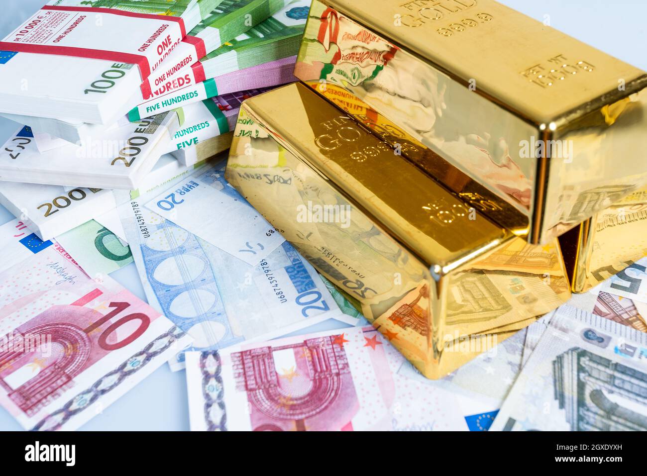 Gold Bullion with euro banknote background Stock Photo - Alamy