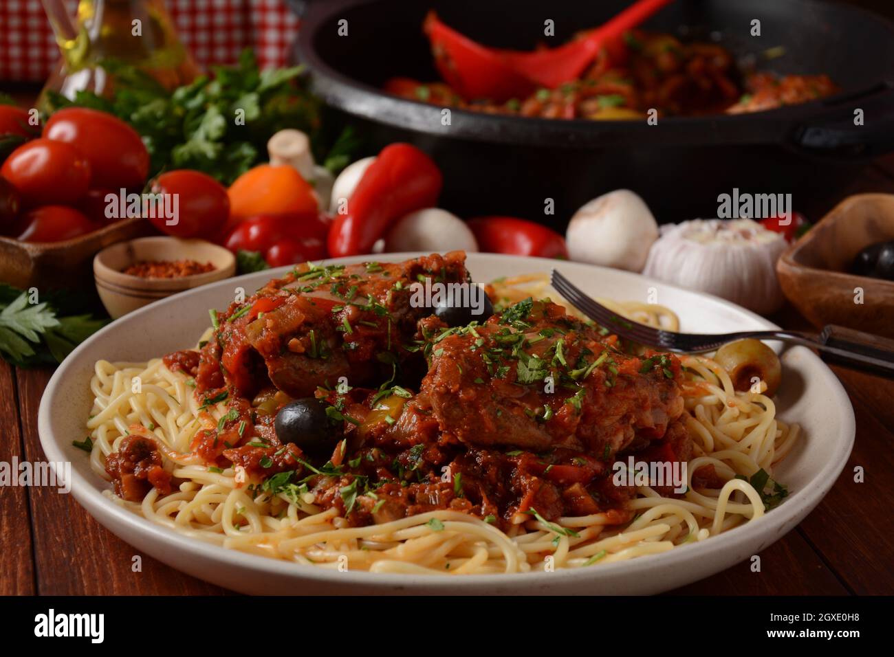 Italian chicken Cacciatore hunter's stew with spaghetti noodles Stock ...
