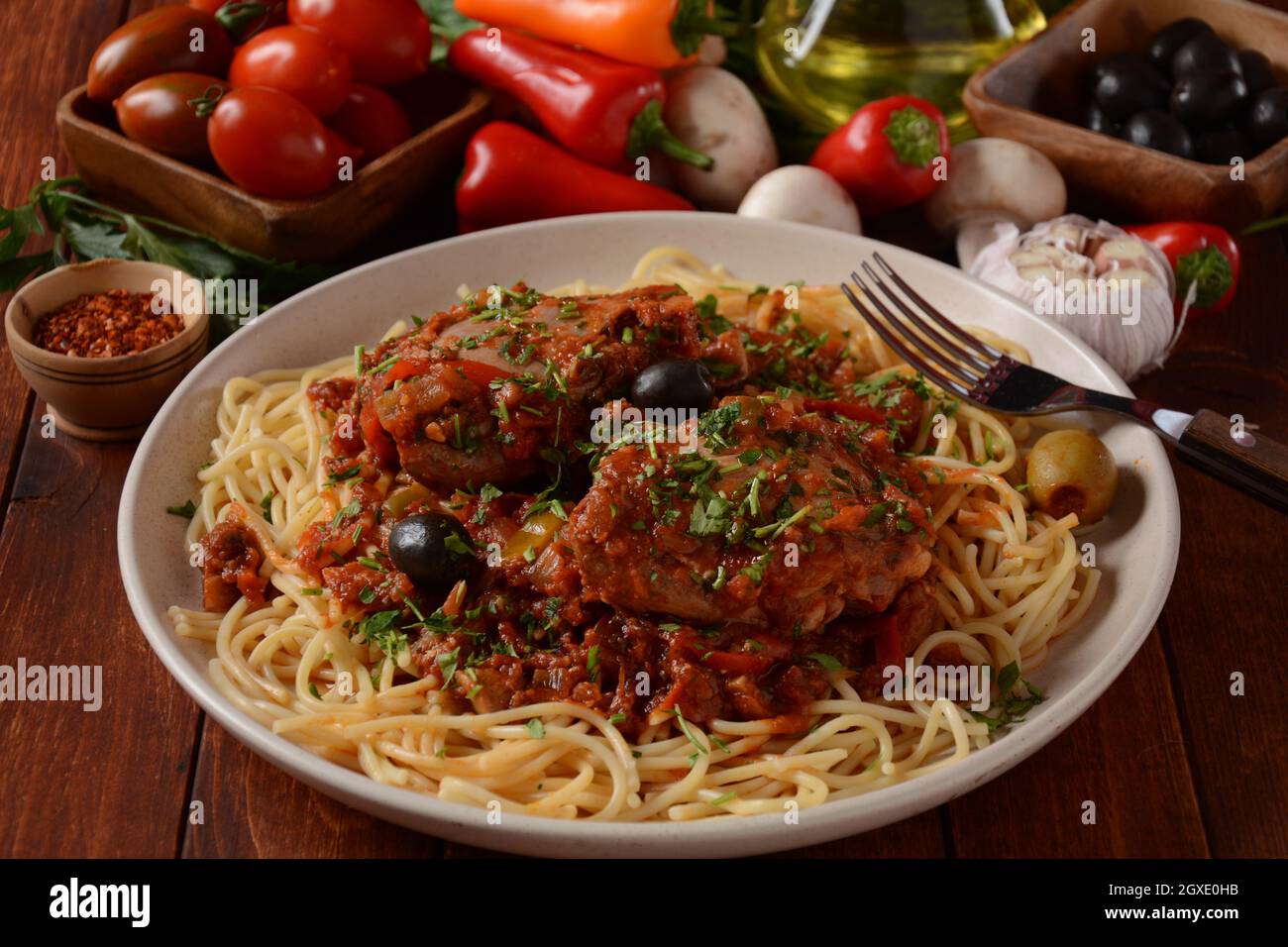 Italian chicken Cacciatore hunter's stew with spaghetti noodles Stock ...