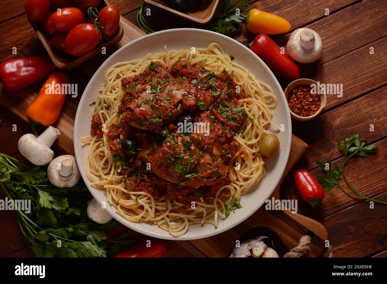 Italian chicken Cacciatore hunter's stew with spaghetti noodles Stock ...