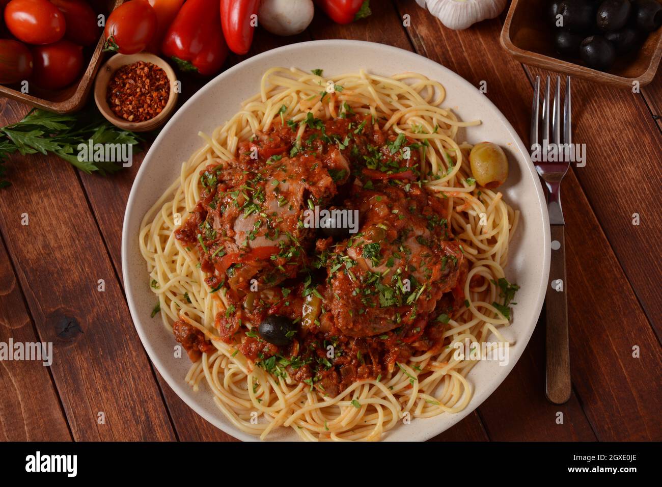 Italian chicken Cacciatore hunter's stew with spaghetti noodles Stock ...