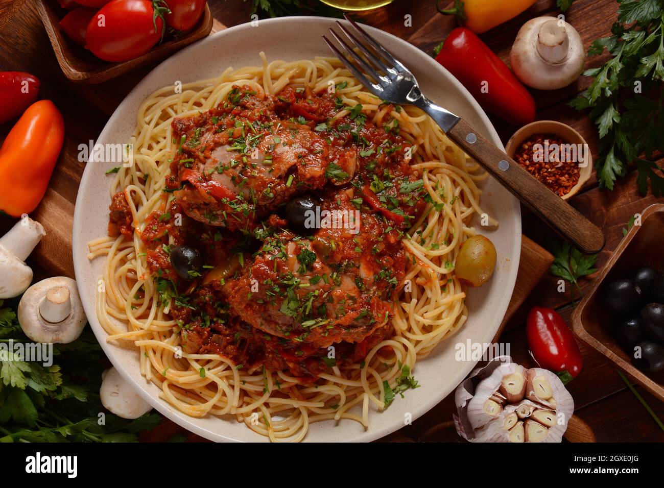 Italian chicken Cacciatore hunter's stew with spaghetti noodles Stock ...