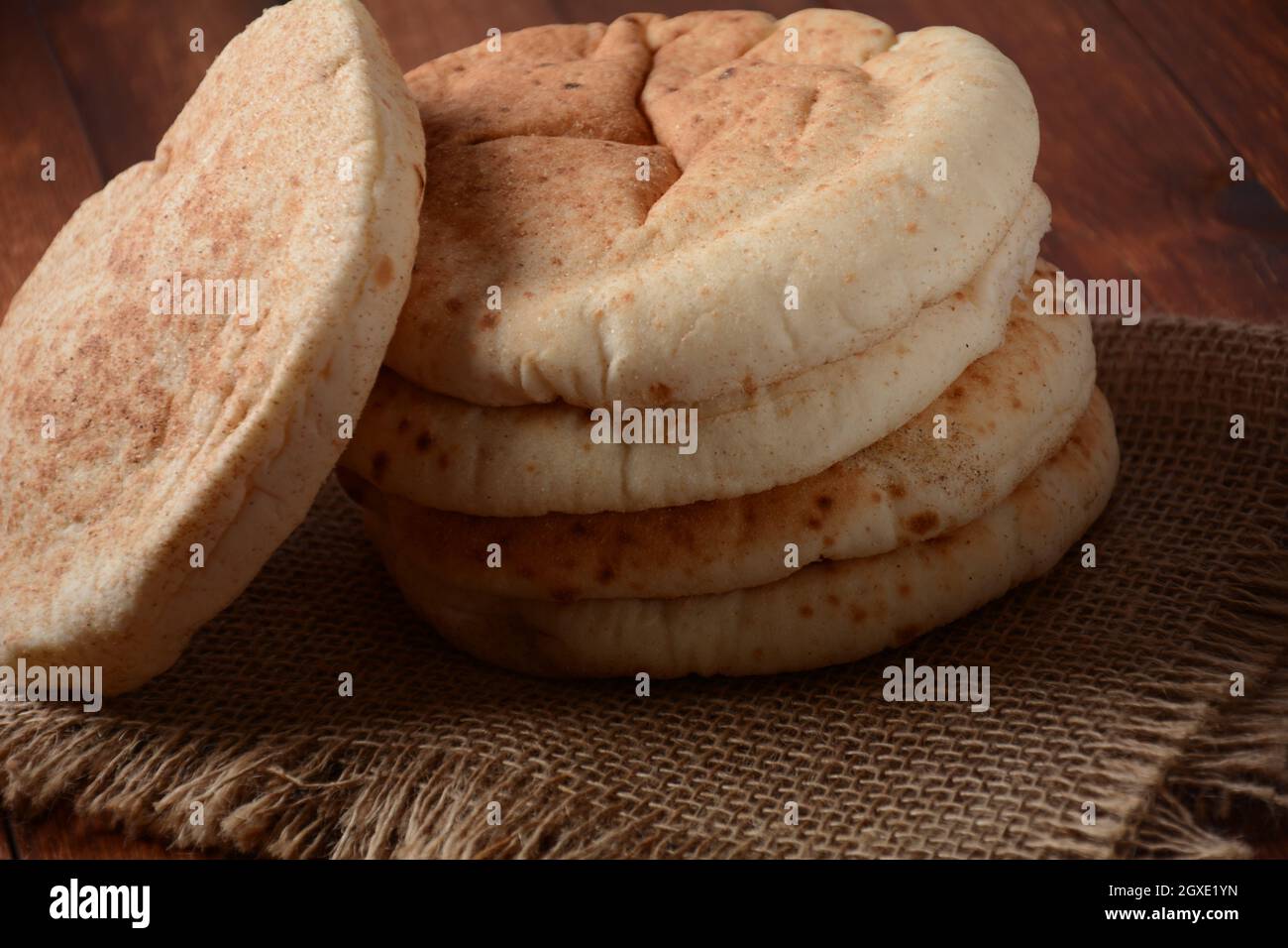 A stack of pita breads. Pita bread on wooden board, Arabic bread, soft ...