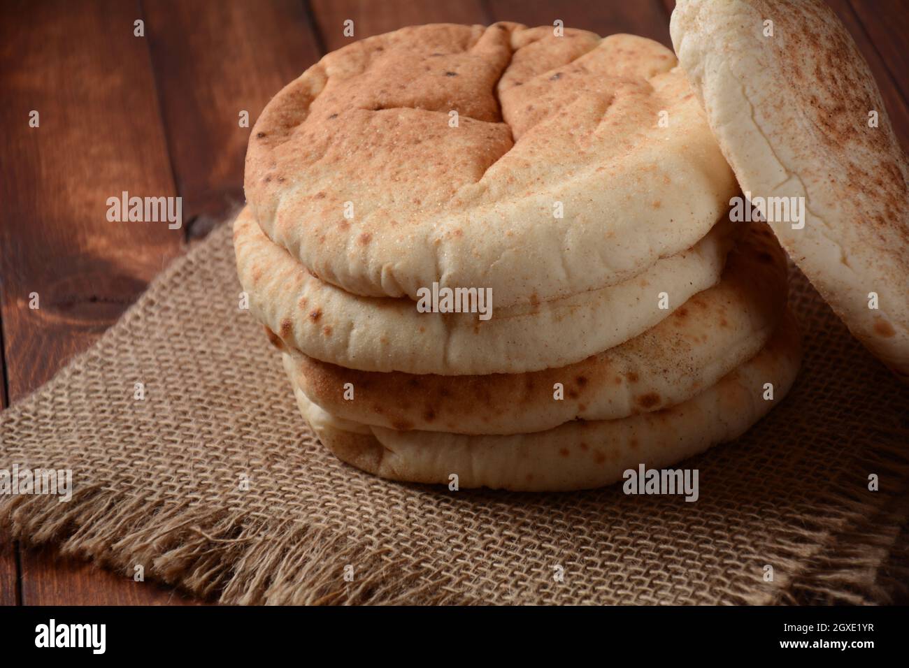 A stack of pita breads. Pita bread on wooden board, Arabic bread, soft ...