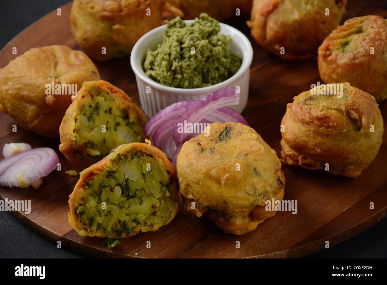Batata vada popular street food of India, Served with green chutney ...