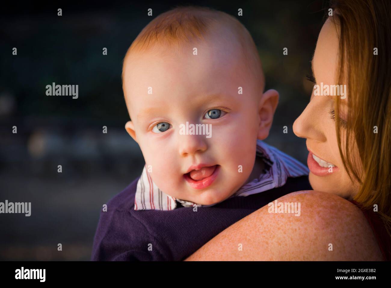 Adorable Red Head Infant Boy Portrait with His Mother Outdoors in ...