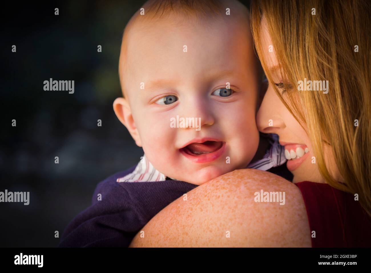 Adorable Red Head Infant Boy Portrait with His Mother Outdoors in ...