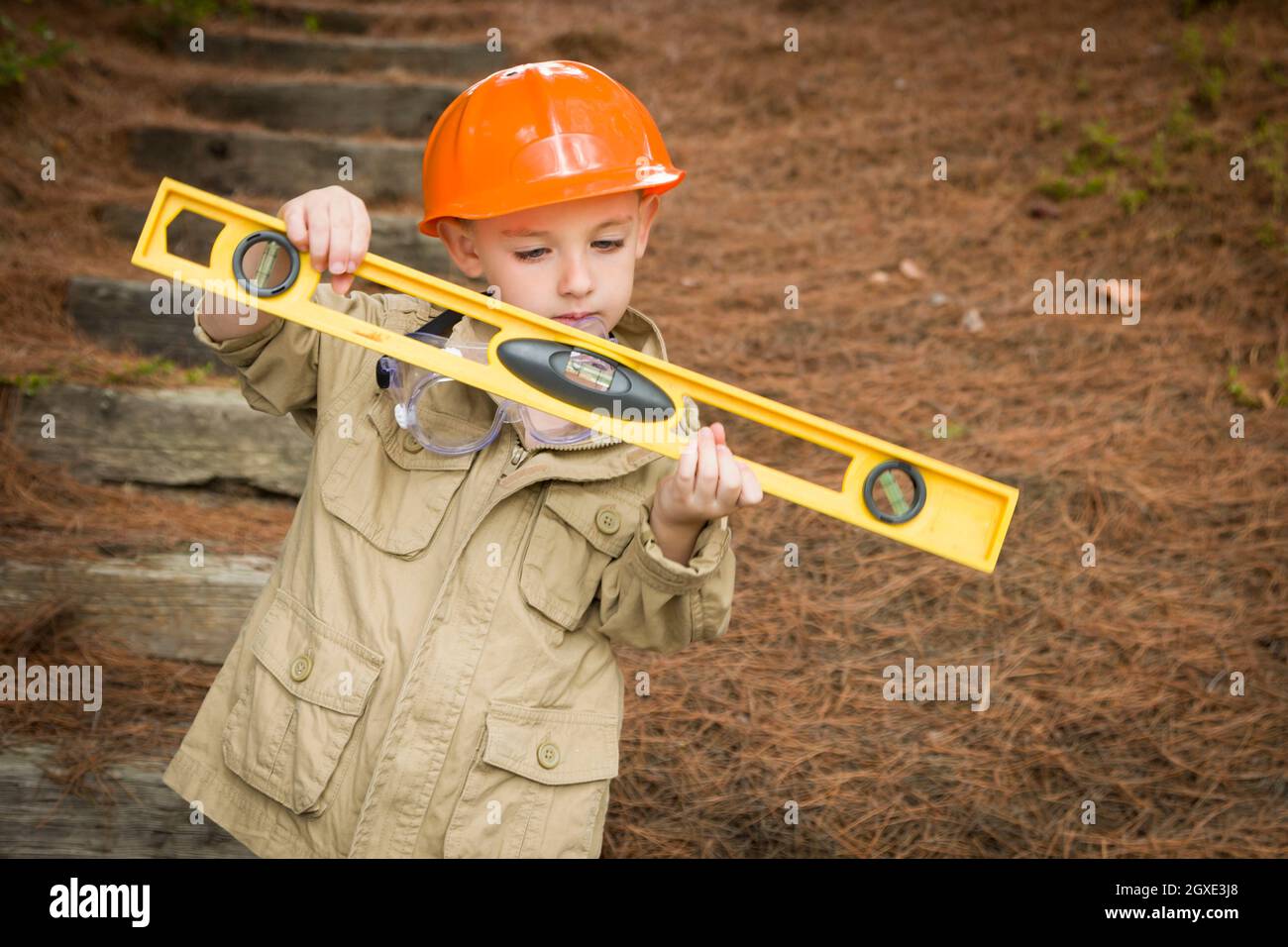 Happy Adorable Child Boy with Level, Hard Hat and Goggles Playing ...