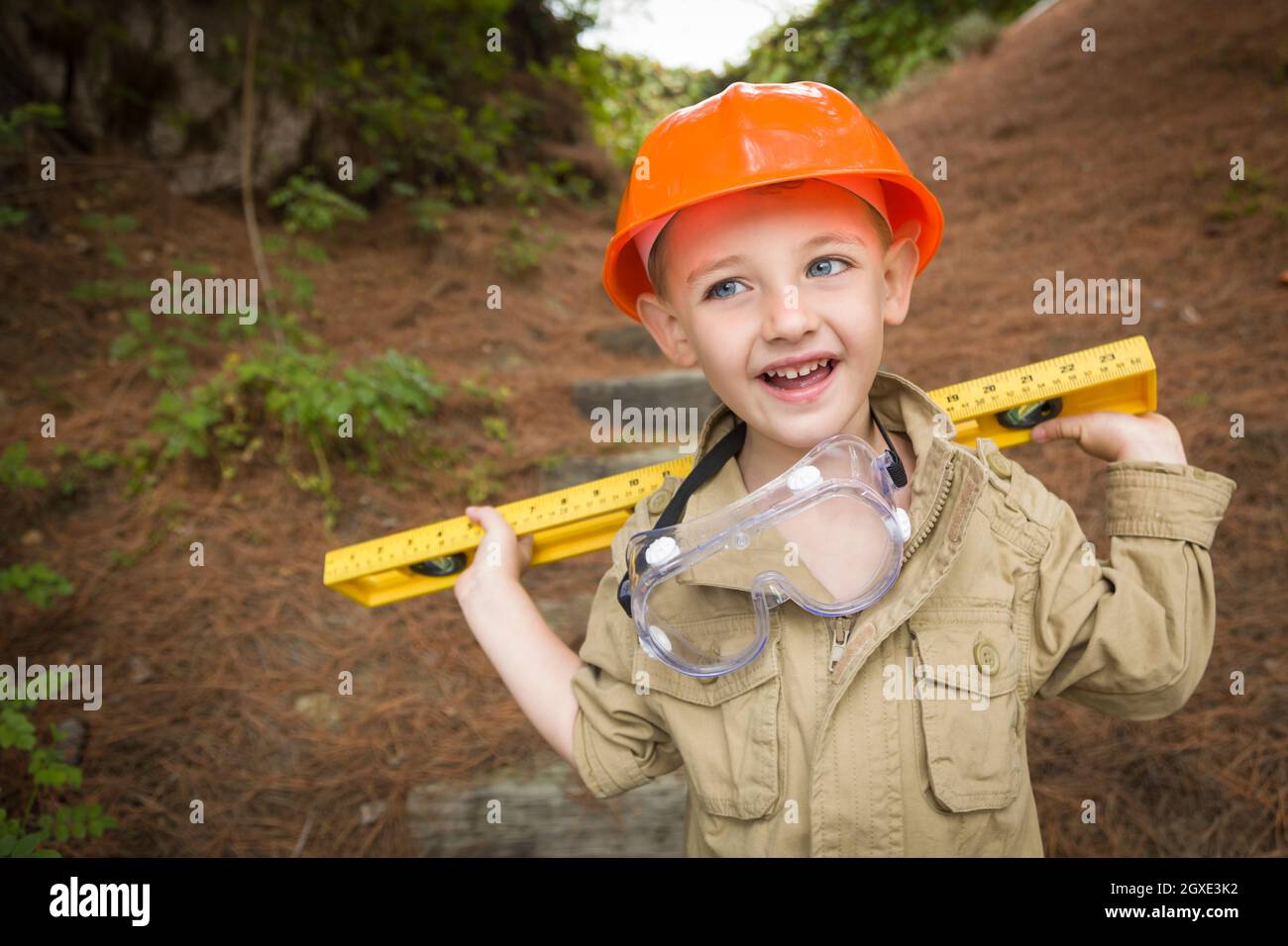 Happy Adorable Child Boy with Level, Hard Hat and Goggles Playing ...
