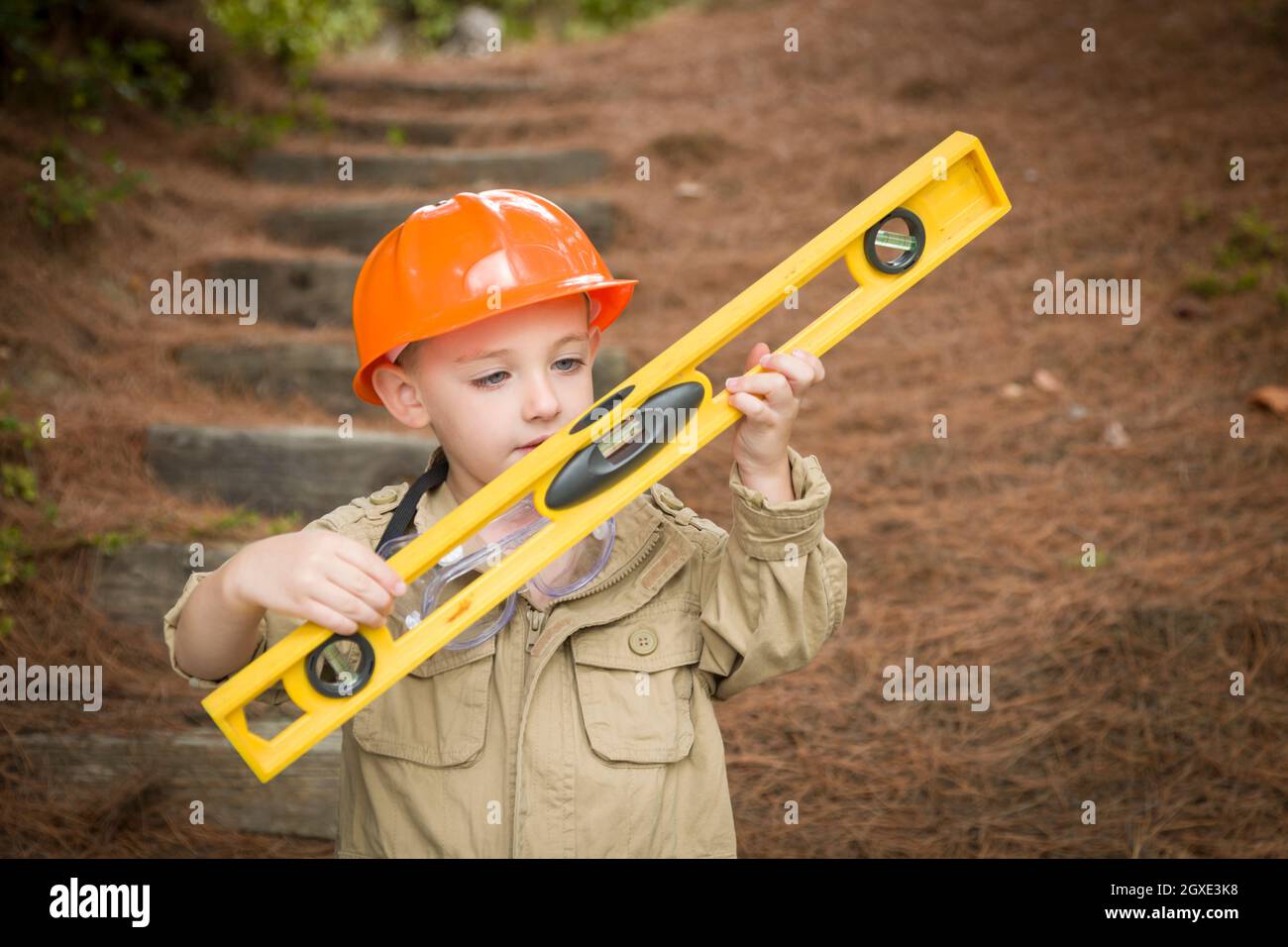 Happy Adorable Child Boy with Level, Hard Hat and Goggles Playing ...