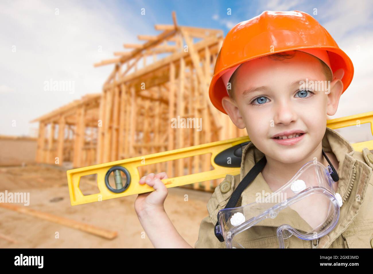 Child Boy Dressed Up as Handyman in Front of New House Framing Stock ...