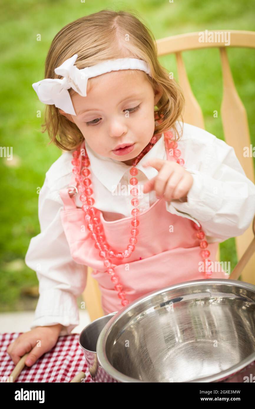 Happy Adorable Little Girl Playing Chef Cooking in Her Pink Outfit ...