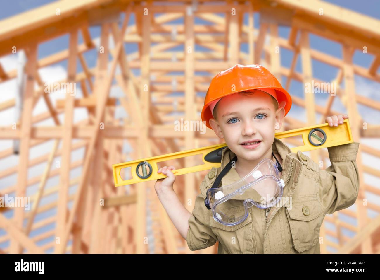 Child Boy Dressed Up as Handyman in Front of New House Framing Stock ...