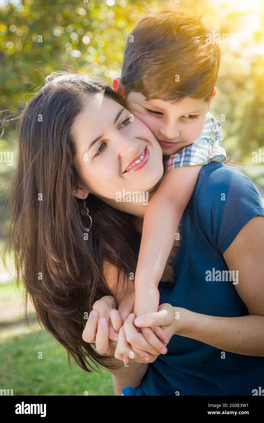 Attractive Young Mixed Race Mother and Son Hug Outdoors in the Park Stock Photo - Alamy