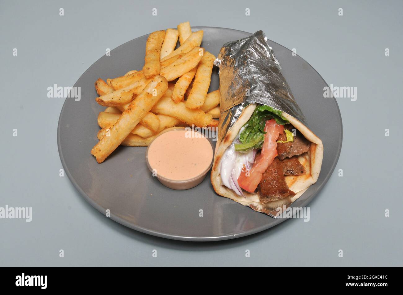 Delicious Greek cuisine known as the grilled steak gyro Stock Photo - Alamy